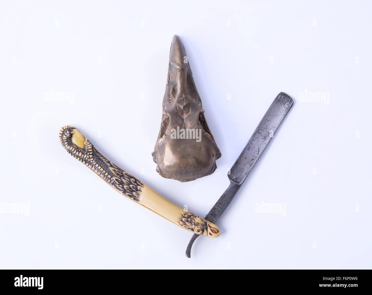 isolated brass crow scull Stock Photo - Alamy