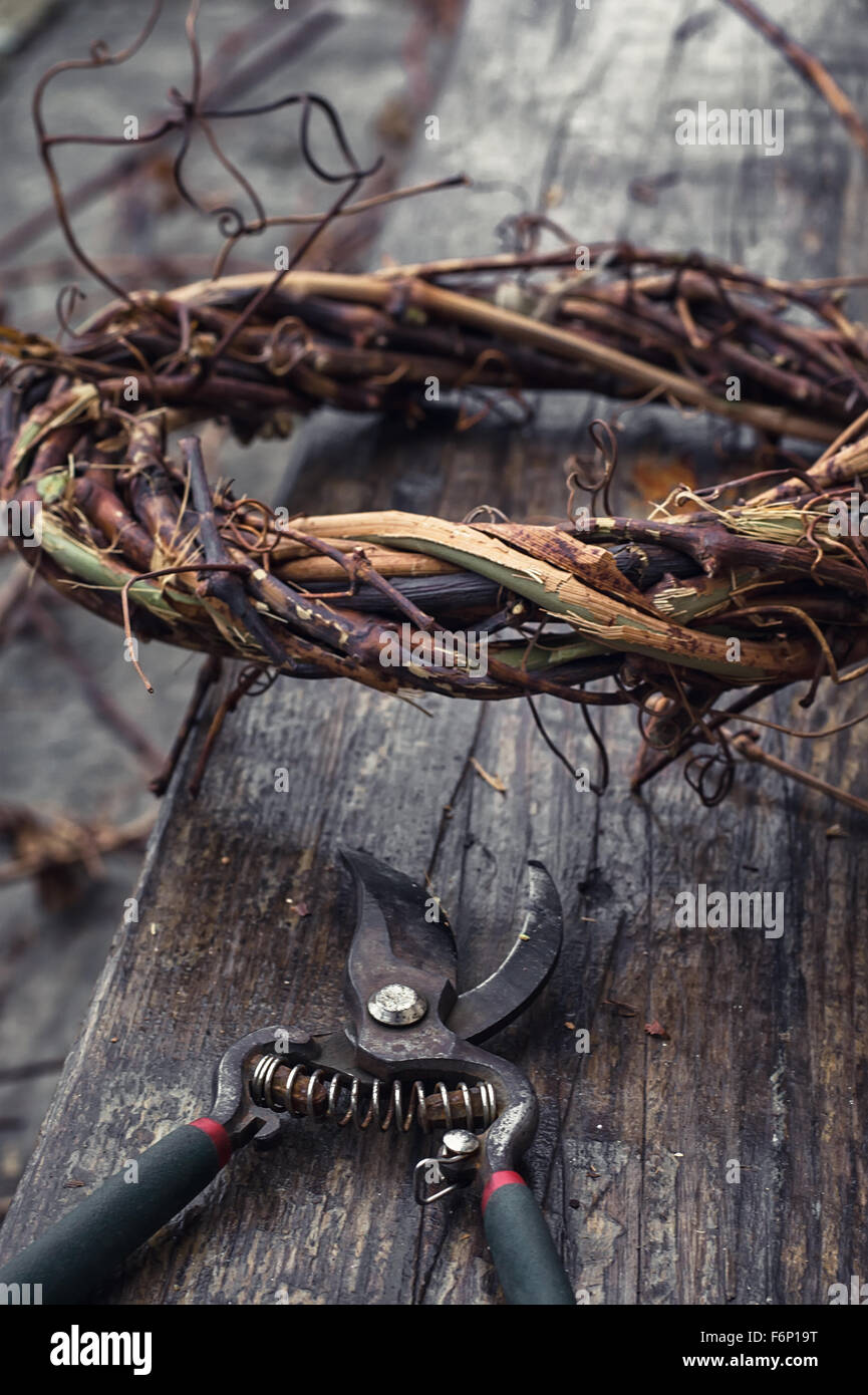 Cut grape branches twisted into crown manually Stock Photo - Alamy