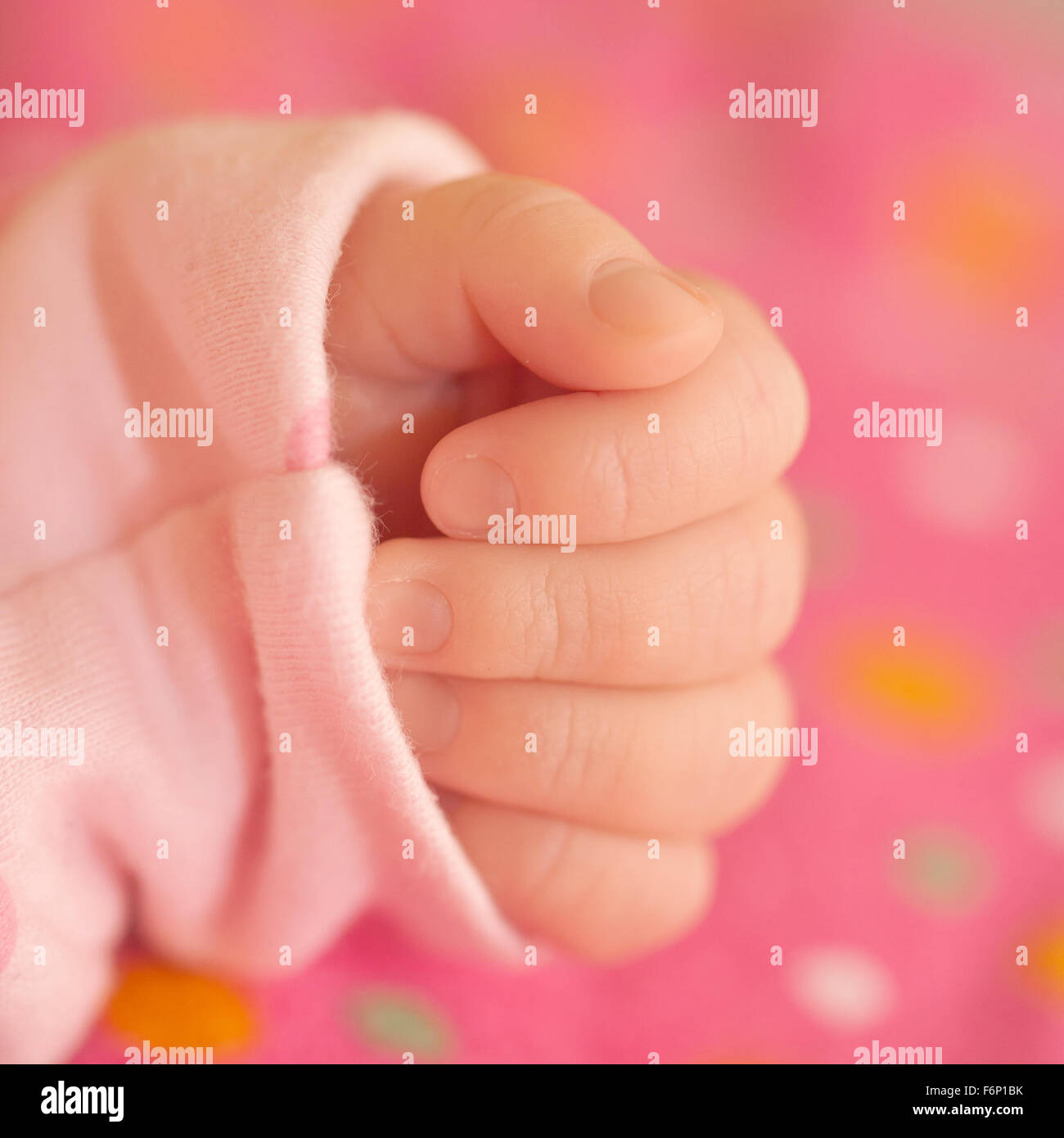 Little hand of a newborn baby. Selective soft focus on tiny fingers ...