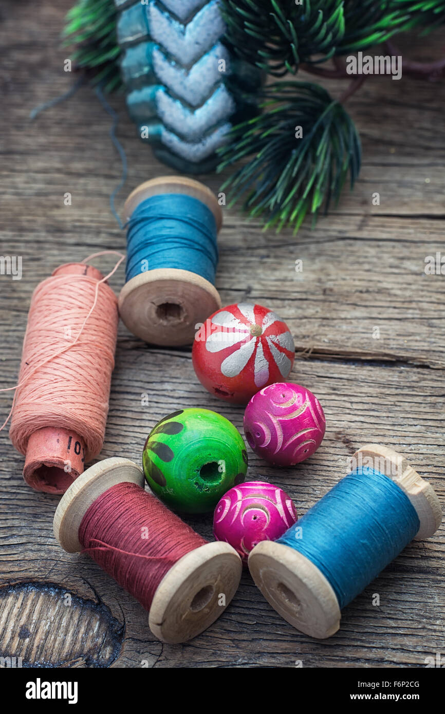 Spools of thread and beads in Christmas songs in vintage style Stock ...