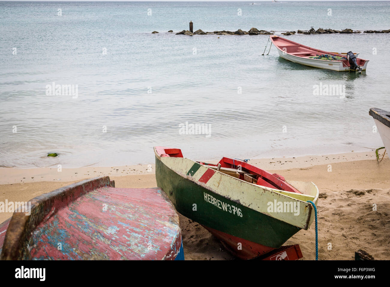 Small boats on the beach in the Caribbean Stock Photo - Alamy