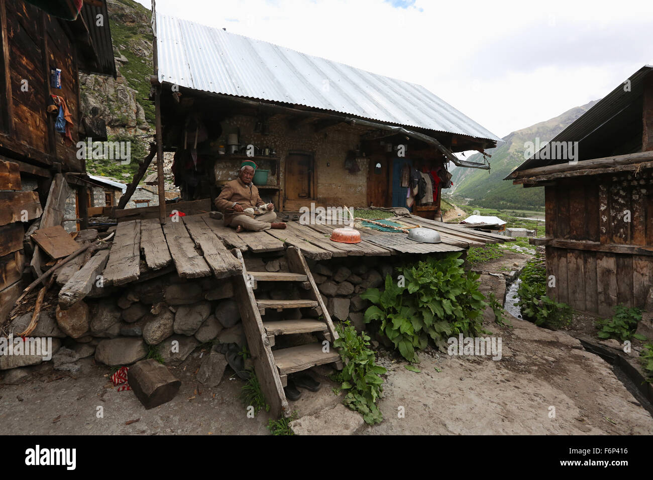 SPITI VALLEY - Old man spinning sheep wool in his traditional painted ...