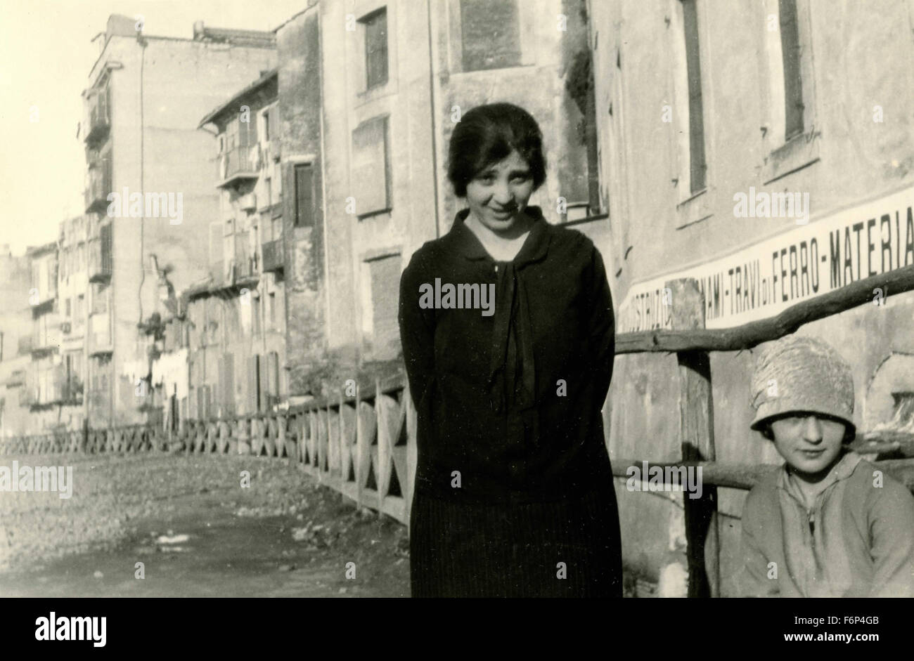 Two girls in a popular neighborhood, Italy Stock Photo - Alamy