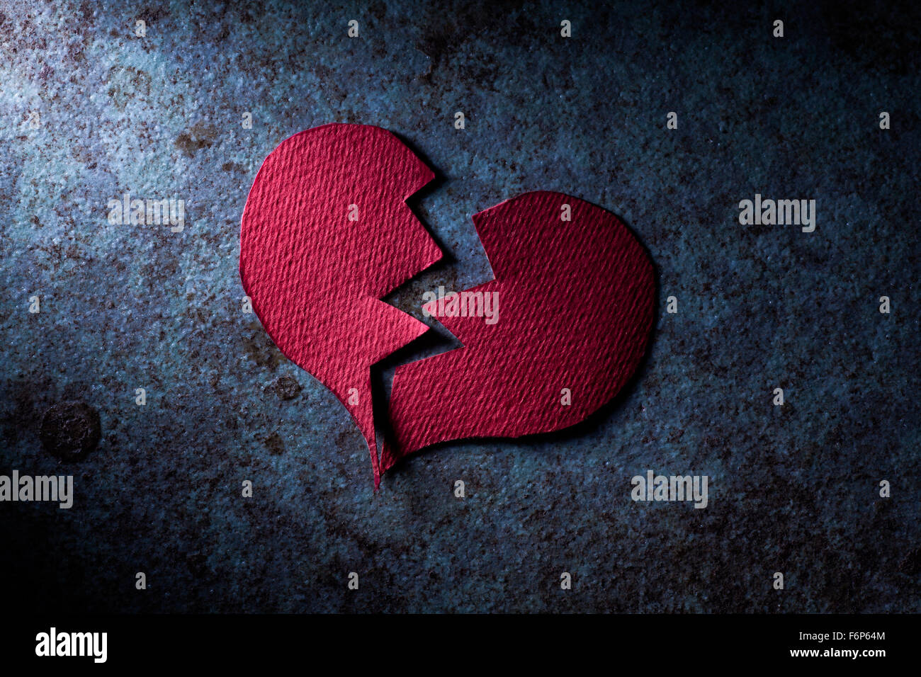 Broken Paper Heart on Blue Grunge Surface Stock Photo - Alamy