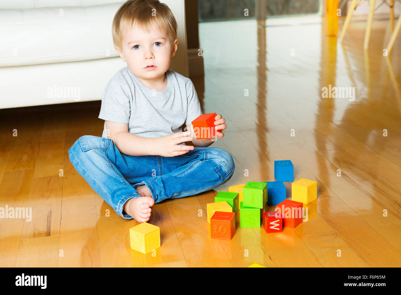 kid playing toy blocks inside his house Stock Photo - Alamy