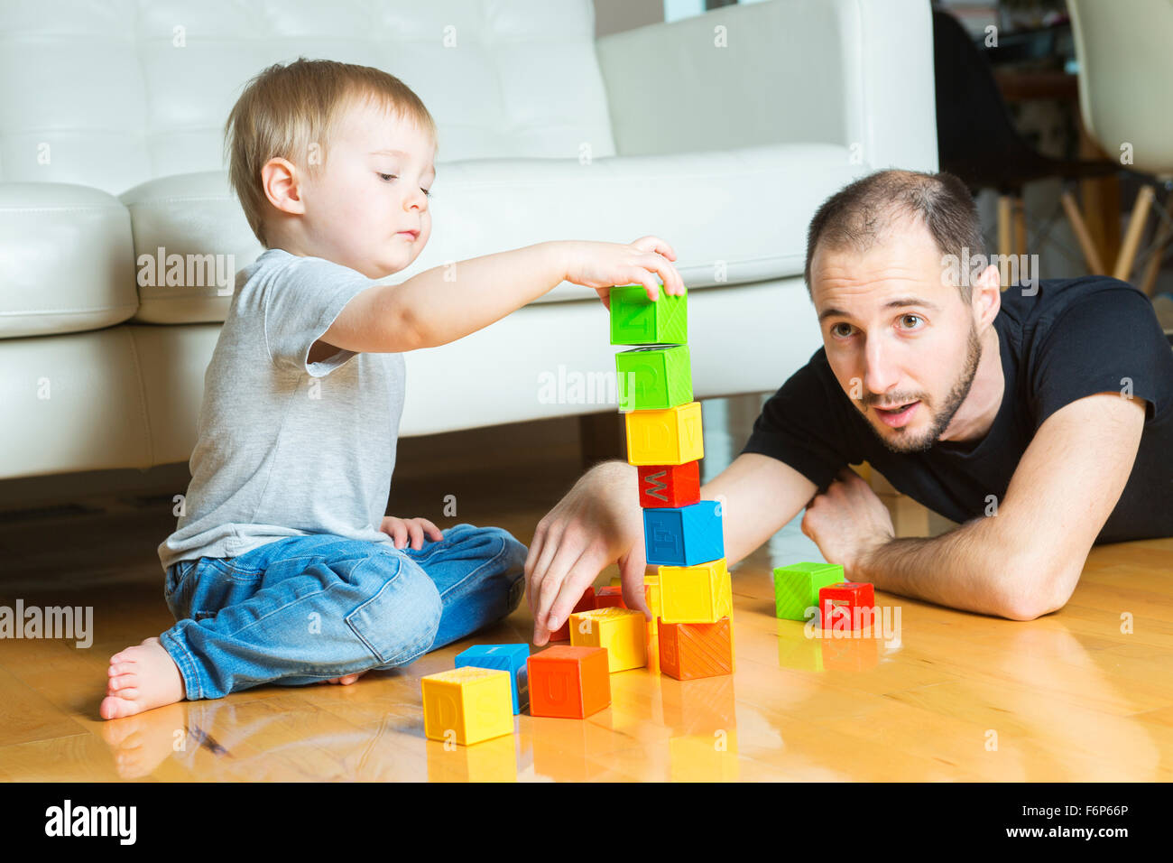 father play block with his son at home Stock Photo - Alamy