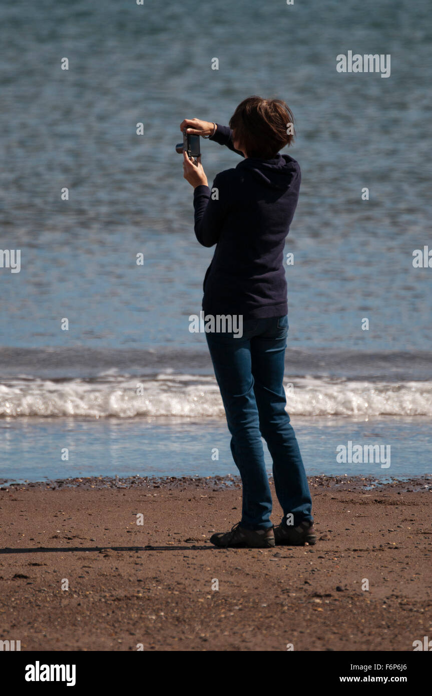 Woman taking picture beach hi-res stock photography and images - Alamy