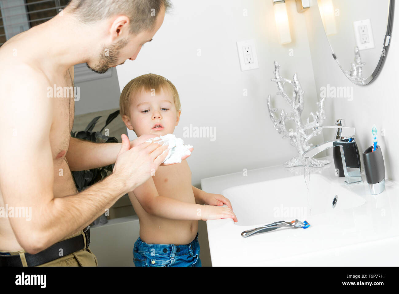 Man in bathroom with child ready to shave Stock Photo - Alamy