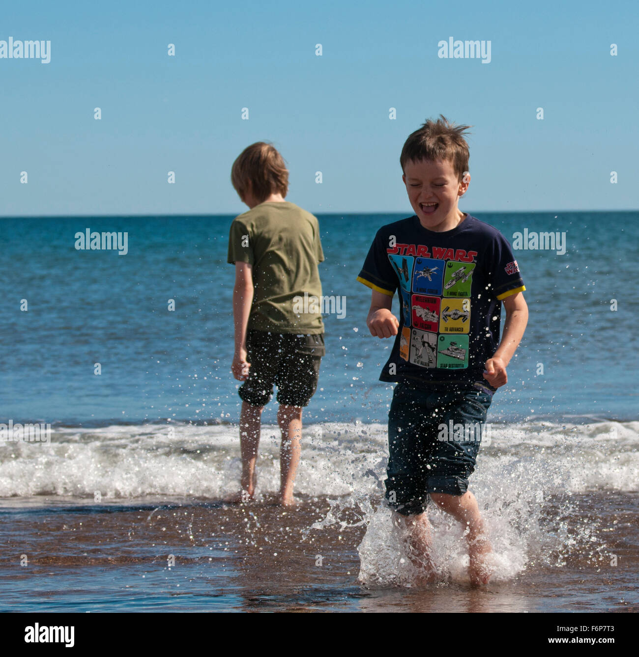 Boys in sea hi-res stock photography and images - Alamy