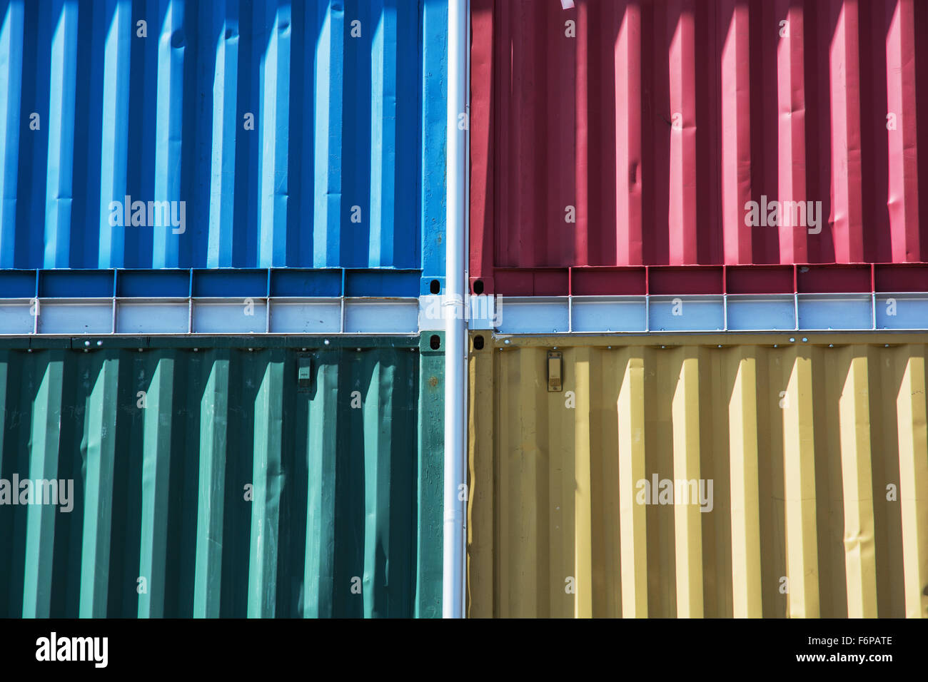 Colorful cargo containers stacked up. Industrial theme Stock Photo - Alamy