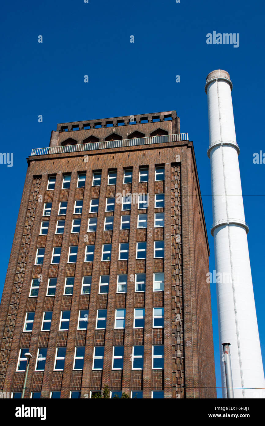 Historic factory with a white smokestack and a brick building Stock ...