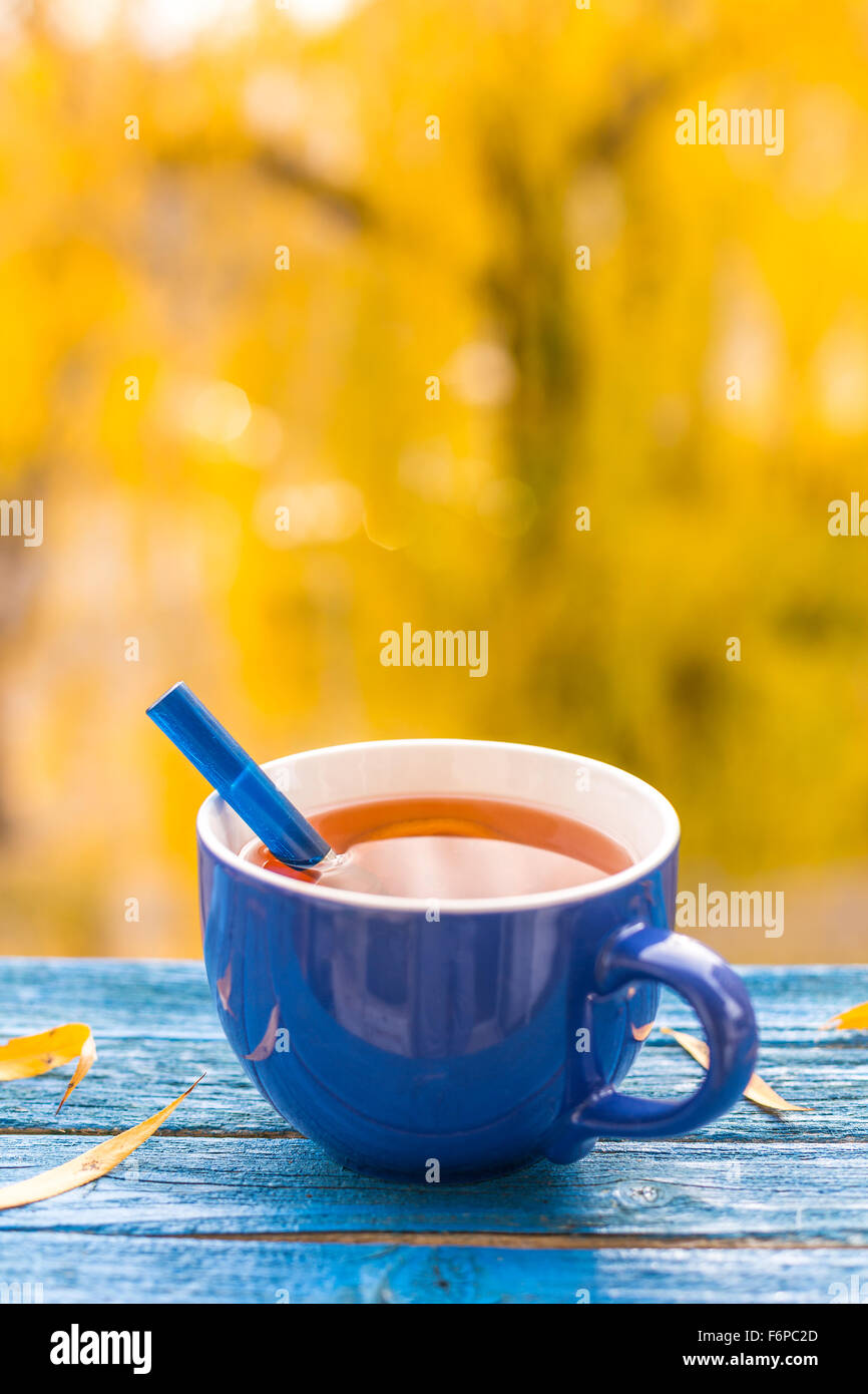Cup of tea with autumn leaves Stock Photo - Alamy