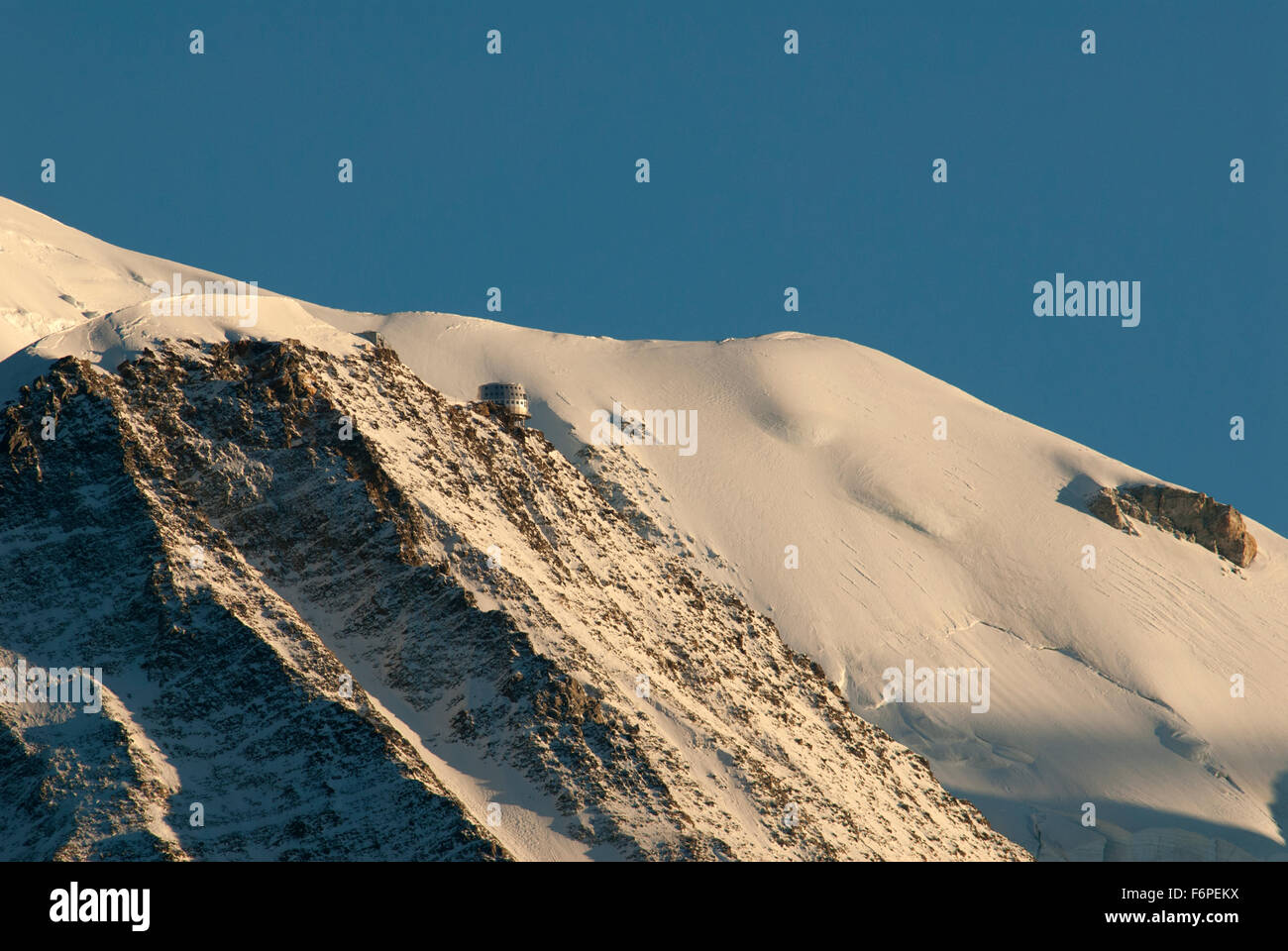 Summit of the Aguille de Gouter peak, with the Gouter high mountain ...