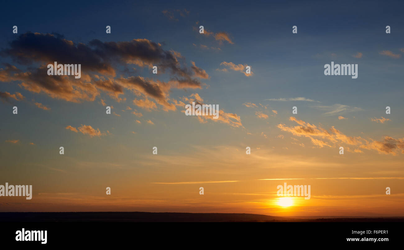 sunset, dark contrast sky and clouds Stock Photo - Alamy