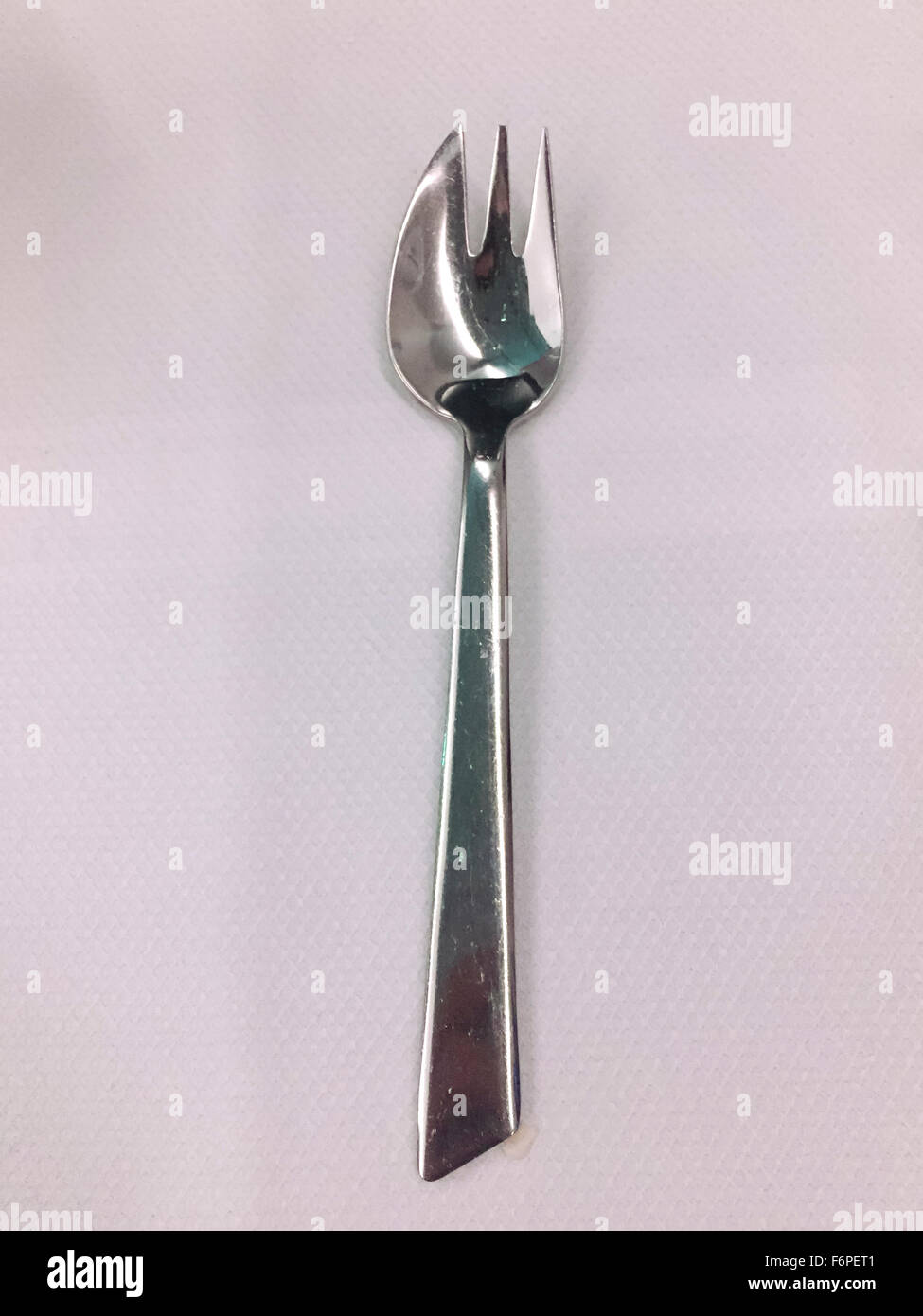 Image of a spork, the combination of a spoon and a fork as a single ...