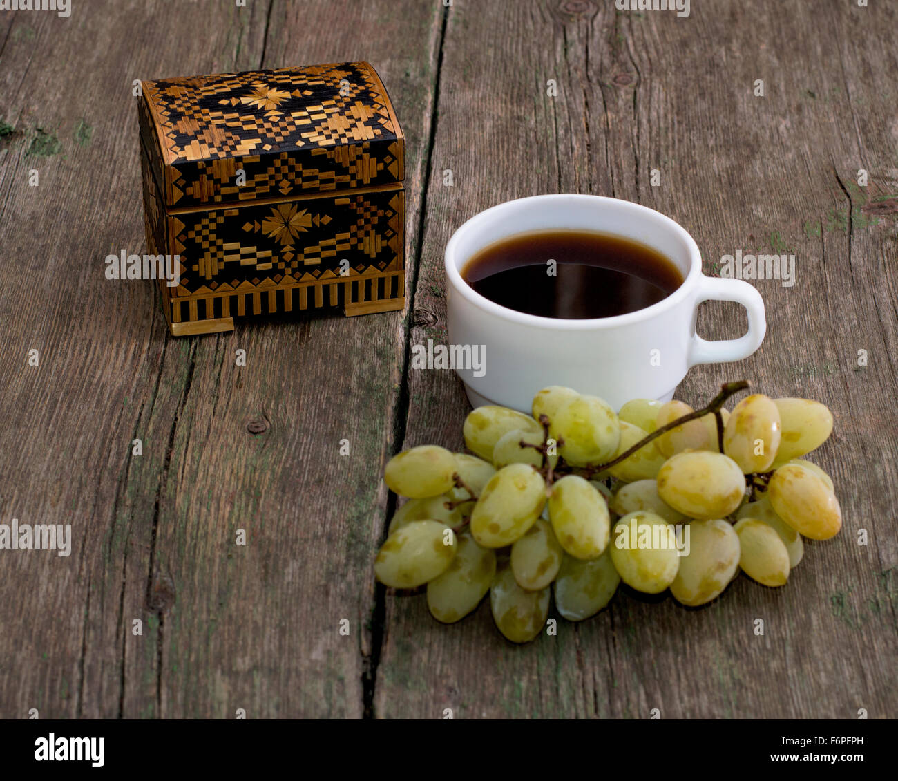 casket, coffee and cluster of grapes Stock Photo - Alamy