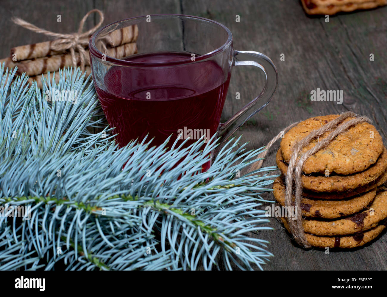 fir-tree branch, tea and oat baking Stock Photo - Alamy