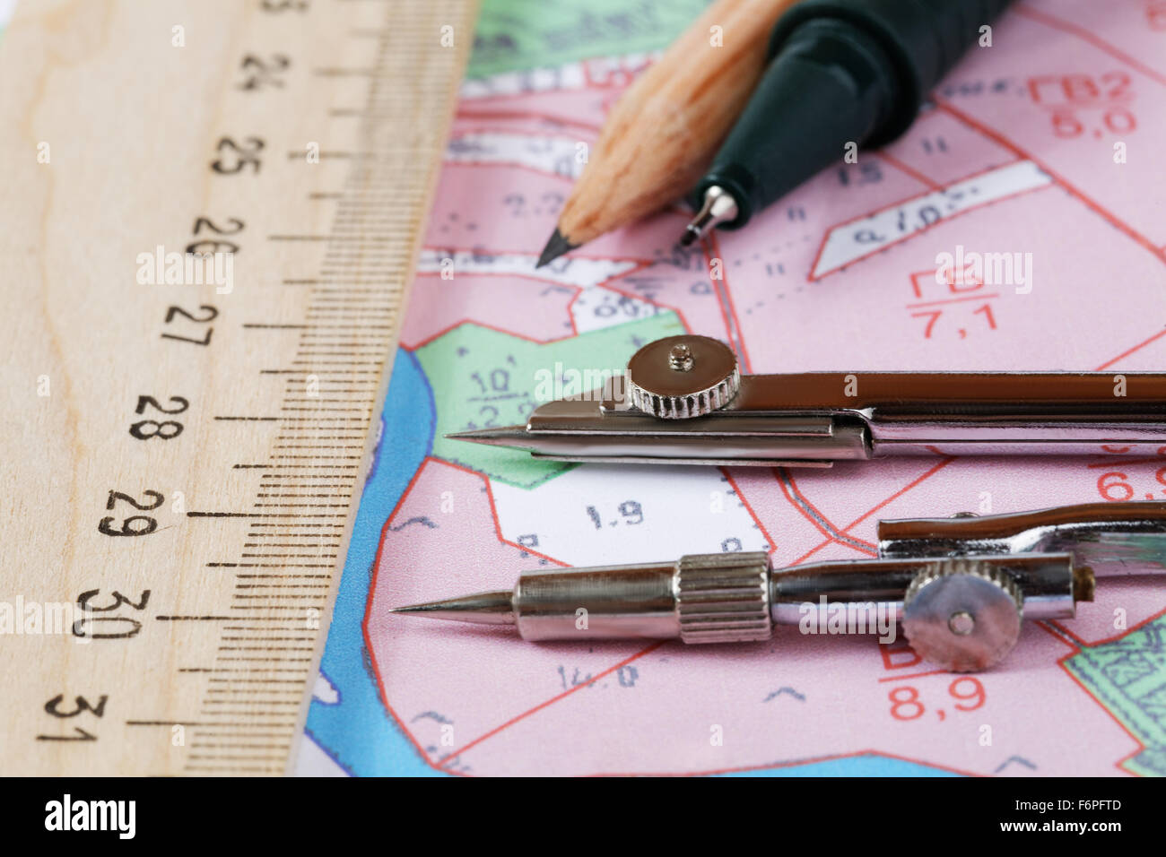 Topographic map of district with measuring instrument and a pencil ...
