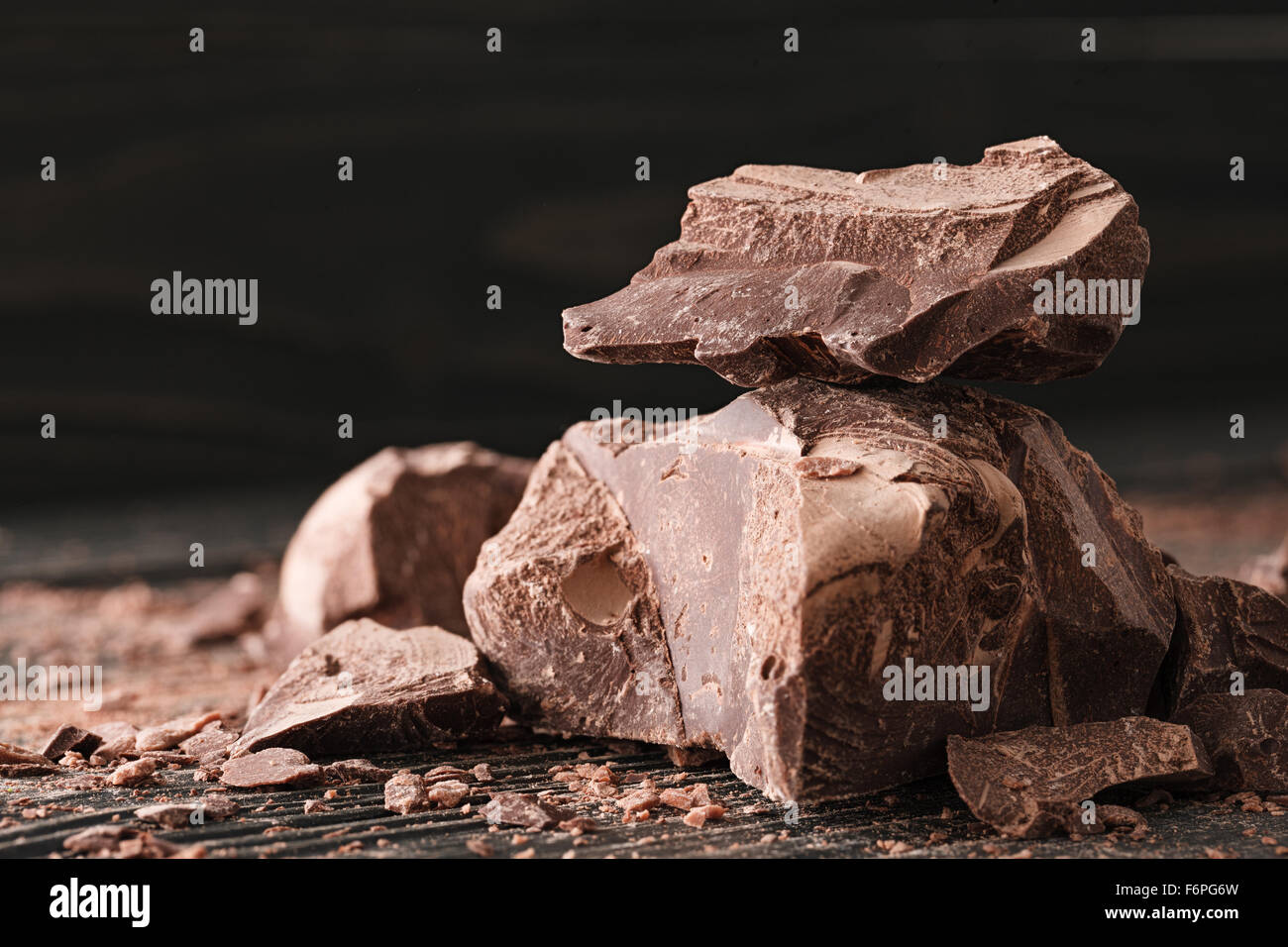 Chocolate pieces on a dark backround Stock Photo - Alamy