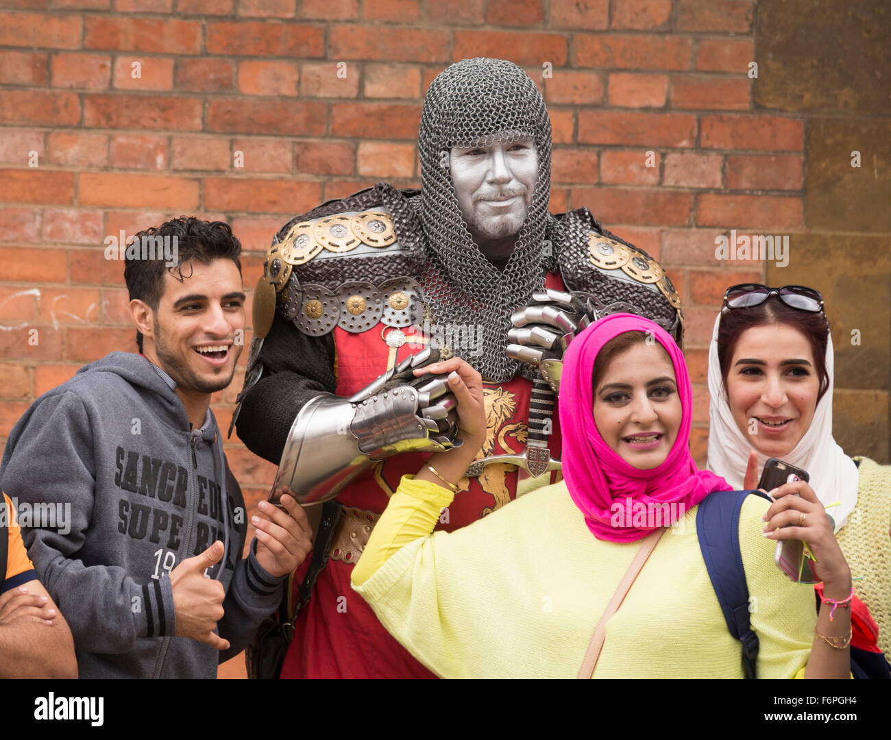 An ethnic family pose with a knight in stratford upon avon the ...