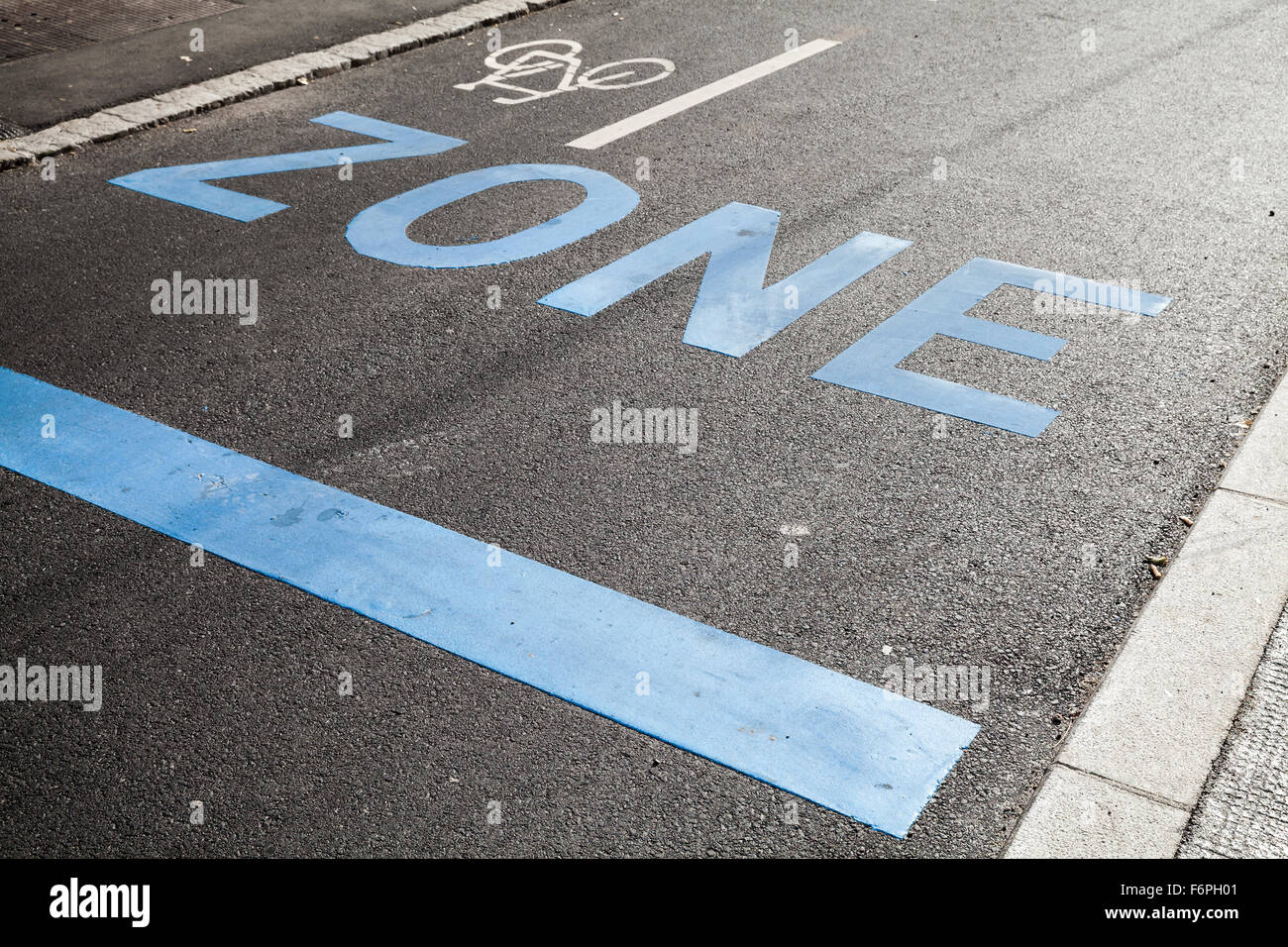 Road marking with blue text zone, stop line and bicycle sign Stock ...