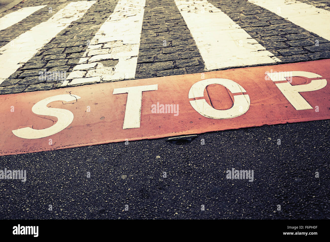 Pedestrian crossing road marking zebra and red stop line on urban road ...