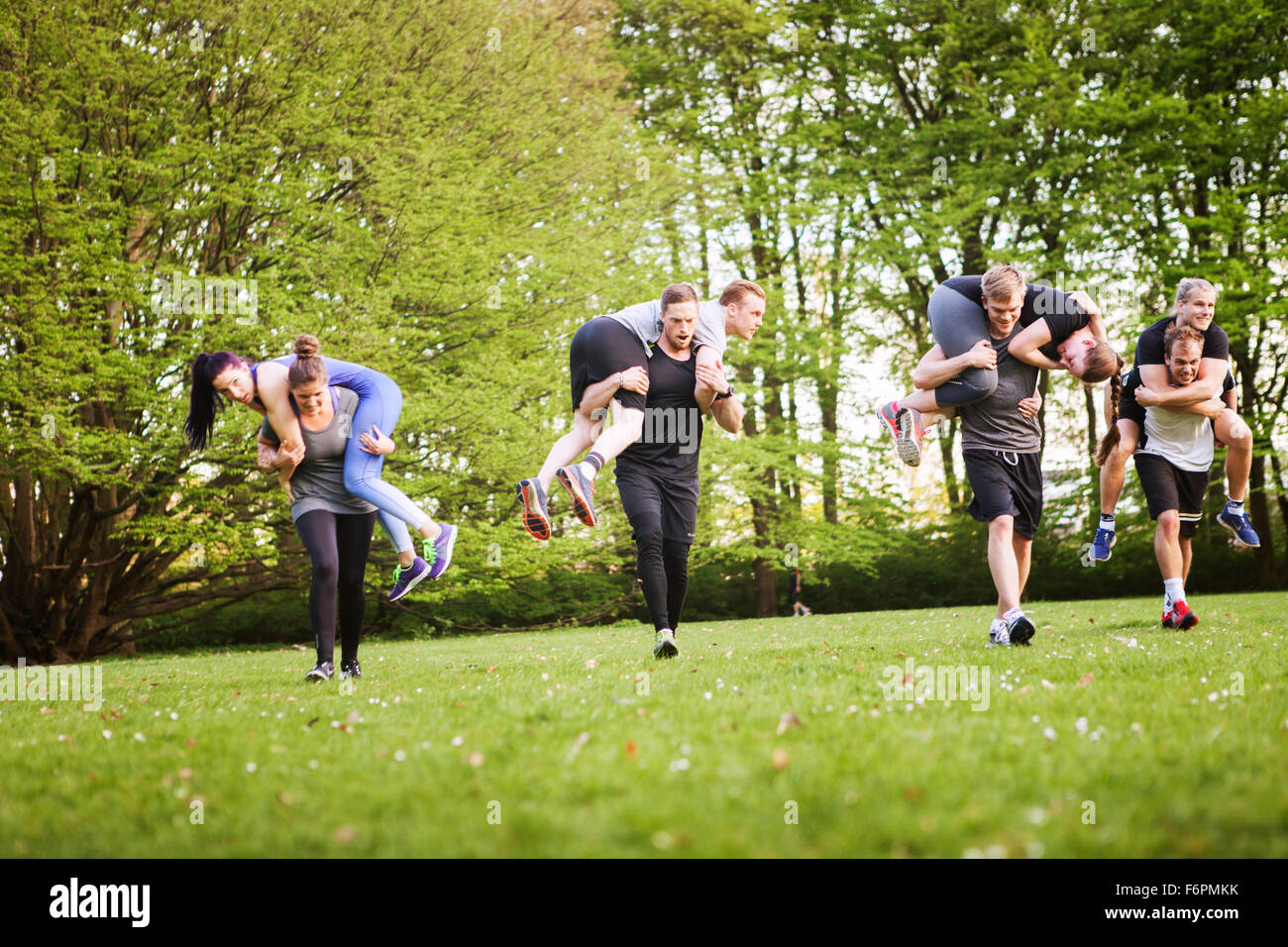 Man Carrying Young Woman On His Shoulders High Resolution Stock ...