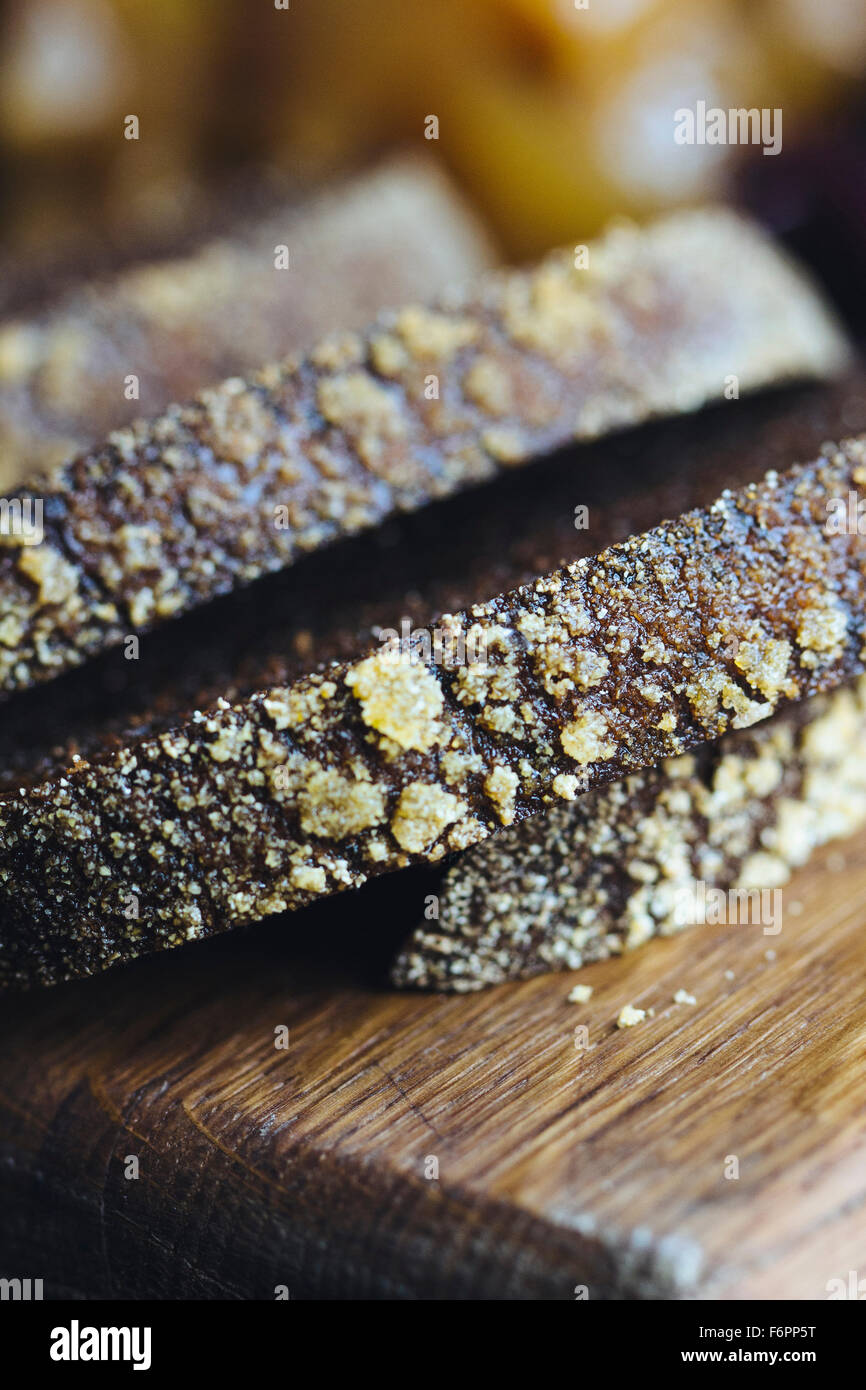 Close up of sliced bread on board Stock Photo - Alamy