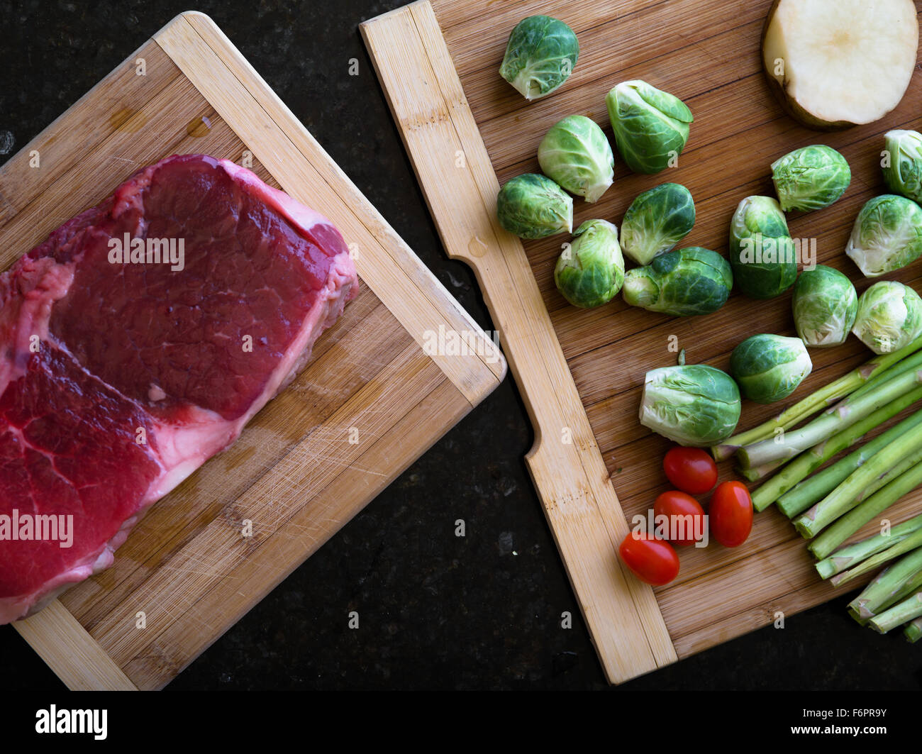 close up view of fresh piece of meat with some vegetables on the back ...