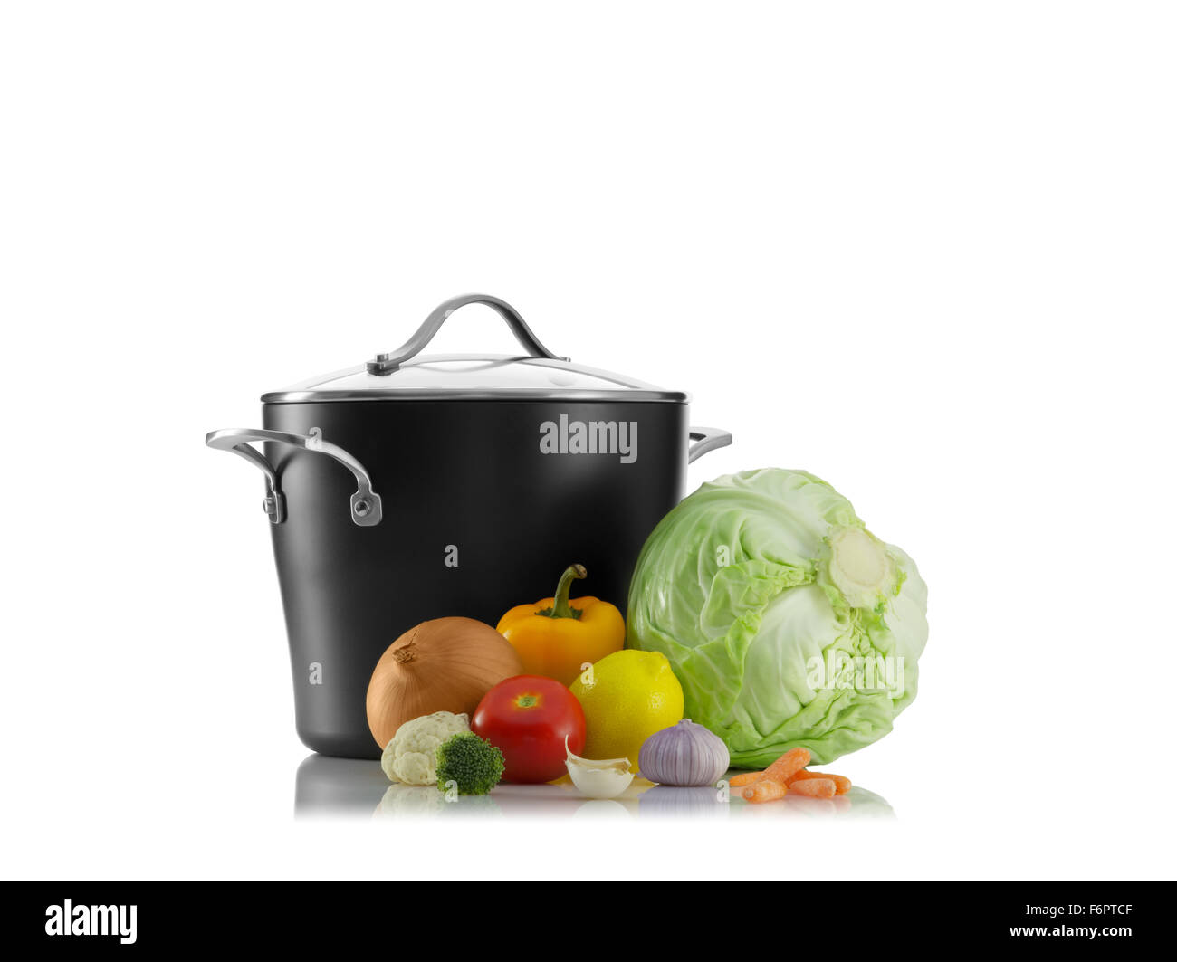 close up view of nice pot with some vegetables on white back Stock ...