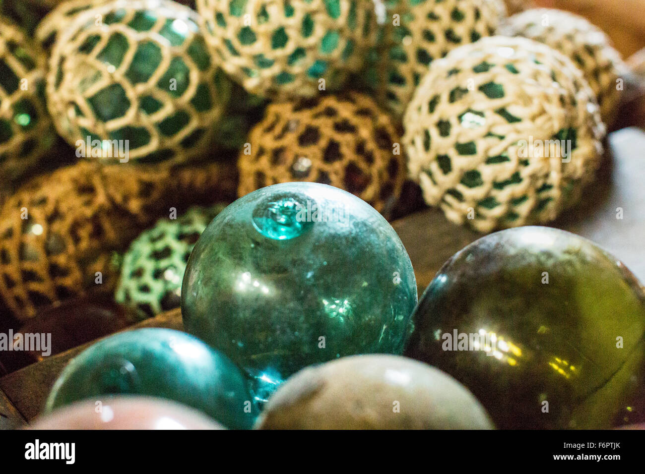Close up of glass ball decorations with fishing net Stock Photo - Alamy