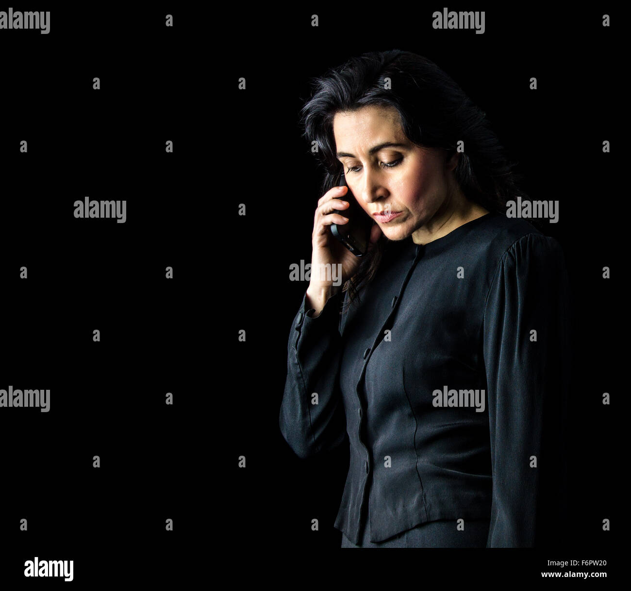 Woman with phone to ear hi-res stock photography and images - Alamy