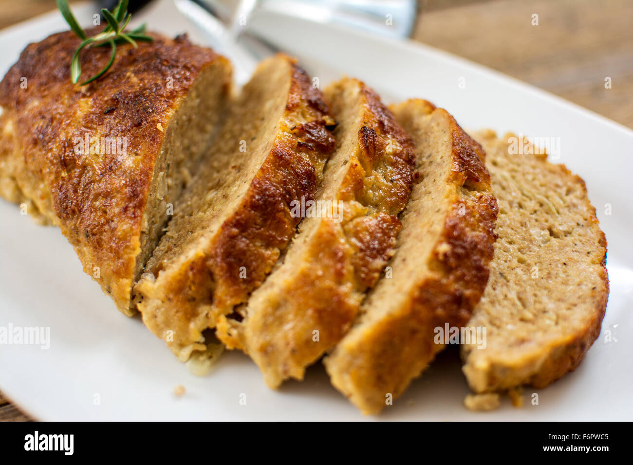 Traditional meat loaf on white plate photography Stock Photo - Alamy