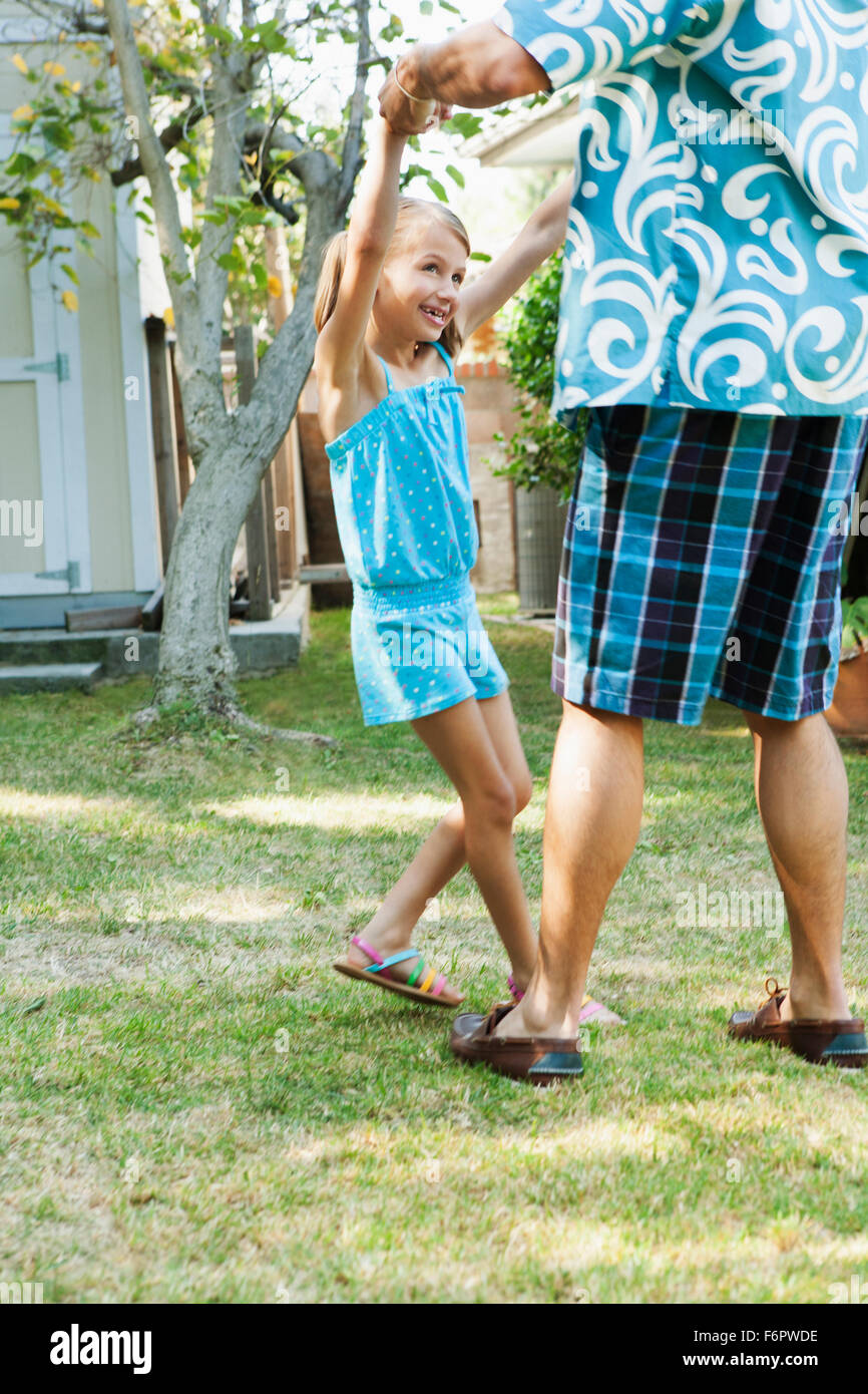 Father and daughter dancing in backyard Stock Photo - Alamy
