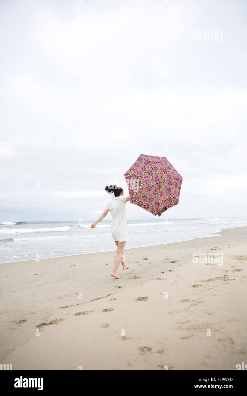 Umbrella wind hi-res stock photography and images - Alamy