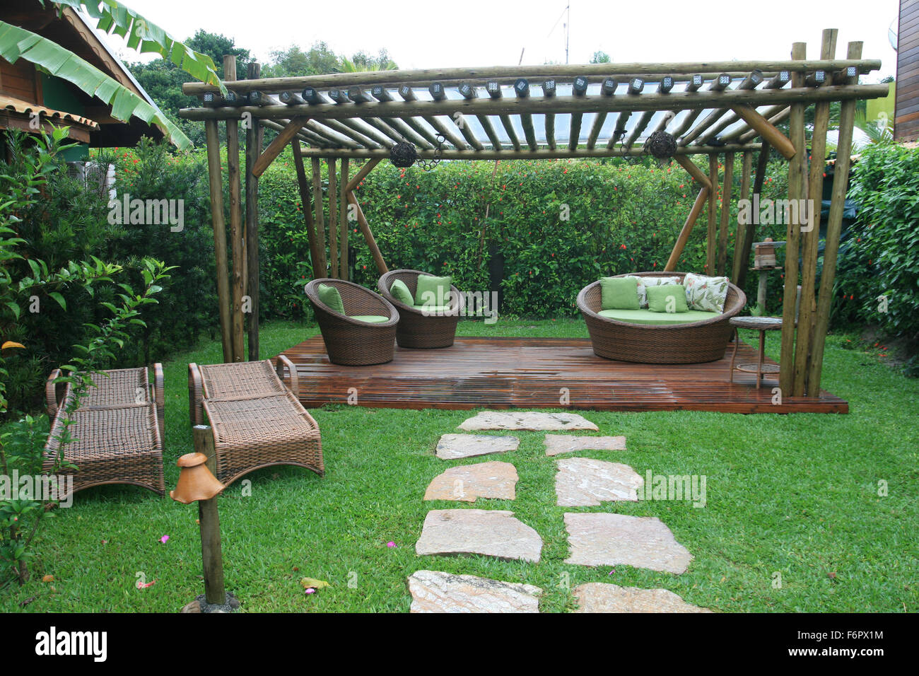 Modern luxury wicker garden with green fresh grass Stock Photo - Alamy