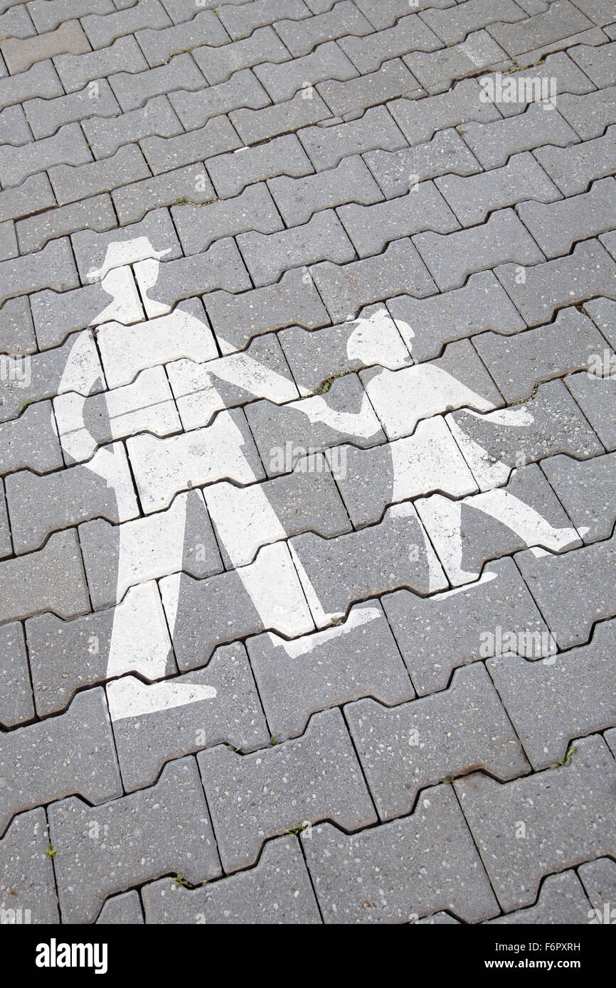 Family Pedestrian Sign on Pavement Stock Photo - Alamy