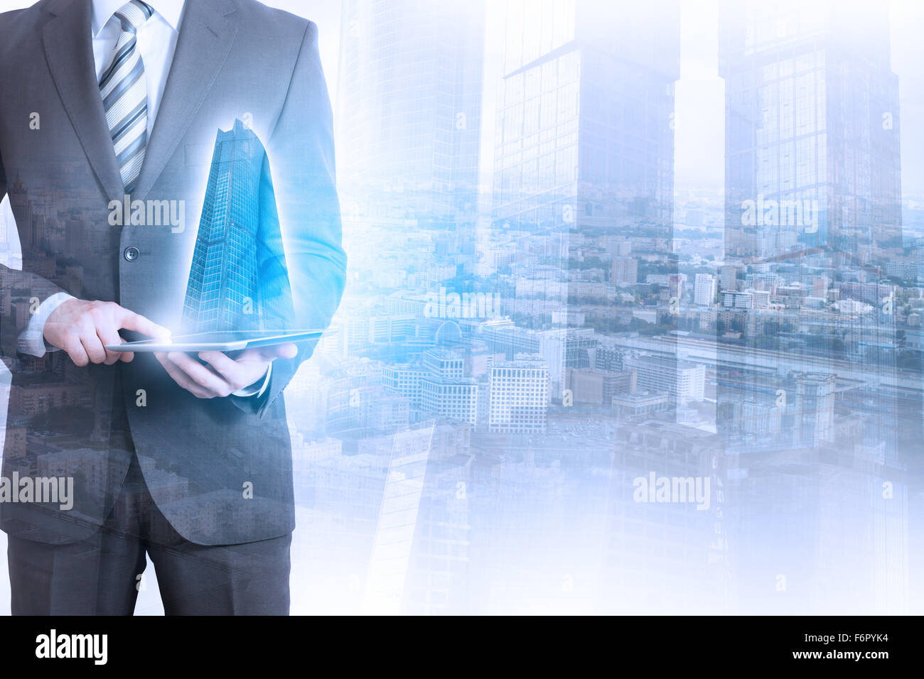 Man touching tablet with 3d city model Stock Photo - Alamy