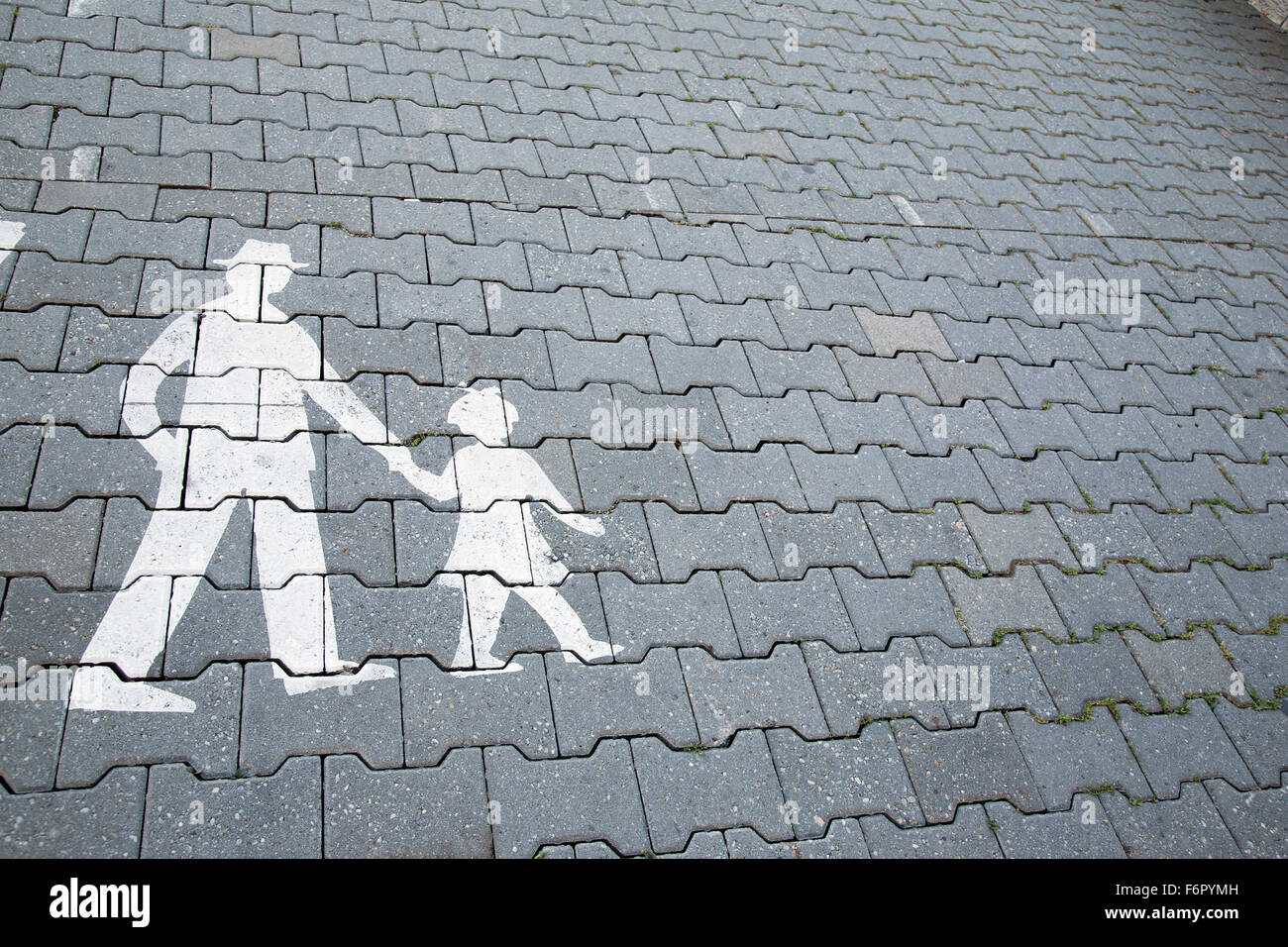 Family Pedestrian Sign on Pavement Stock Photo - Alamy