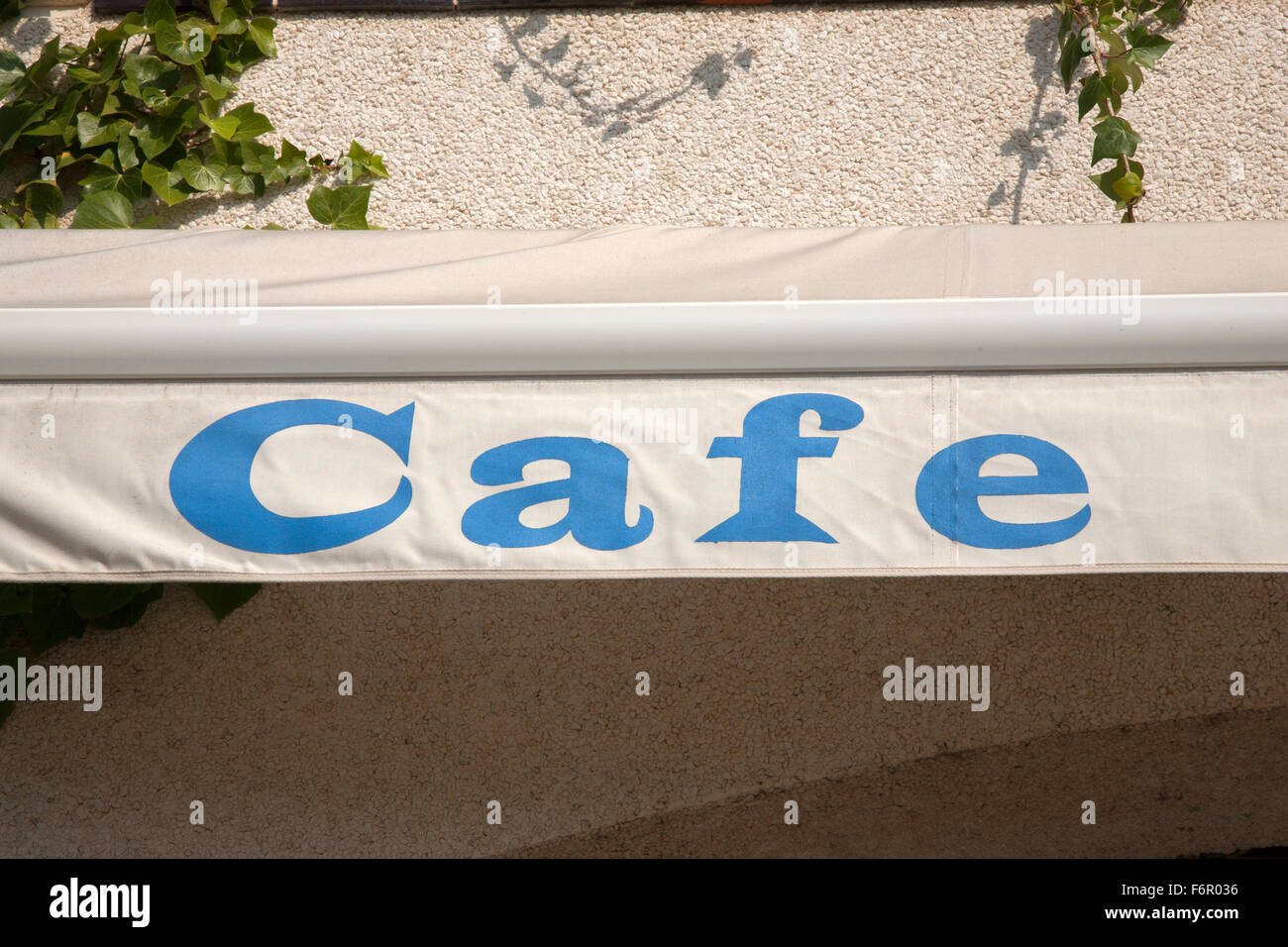 Cafe Sign against Building Background Stock Photo - Alamy