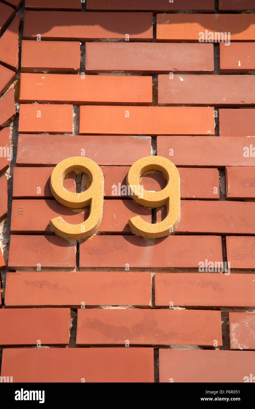 Number Ninety-Nine on Brick Wall Background Stock Photo - Alamy