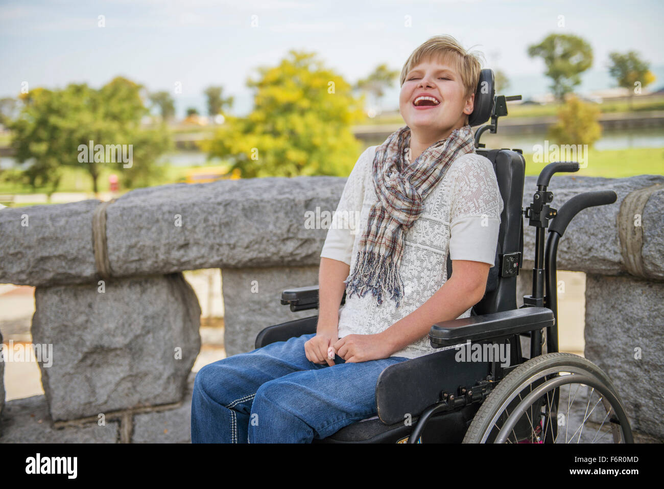 Paraplegic woman laughing in wheelchair Stock Photo - Alamy
