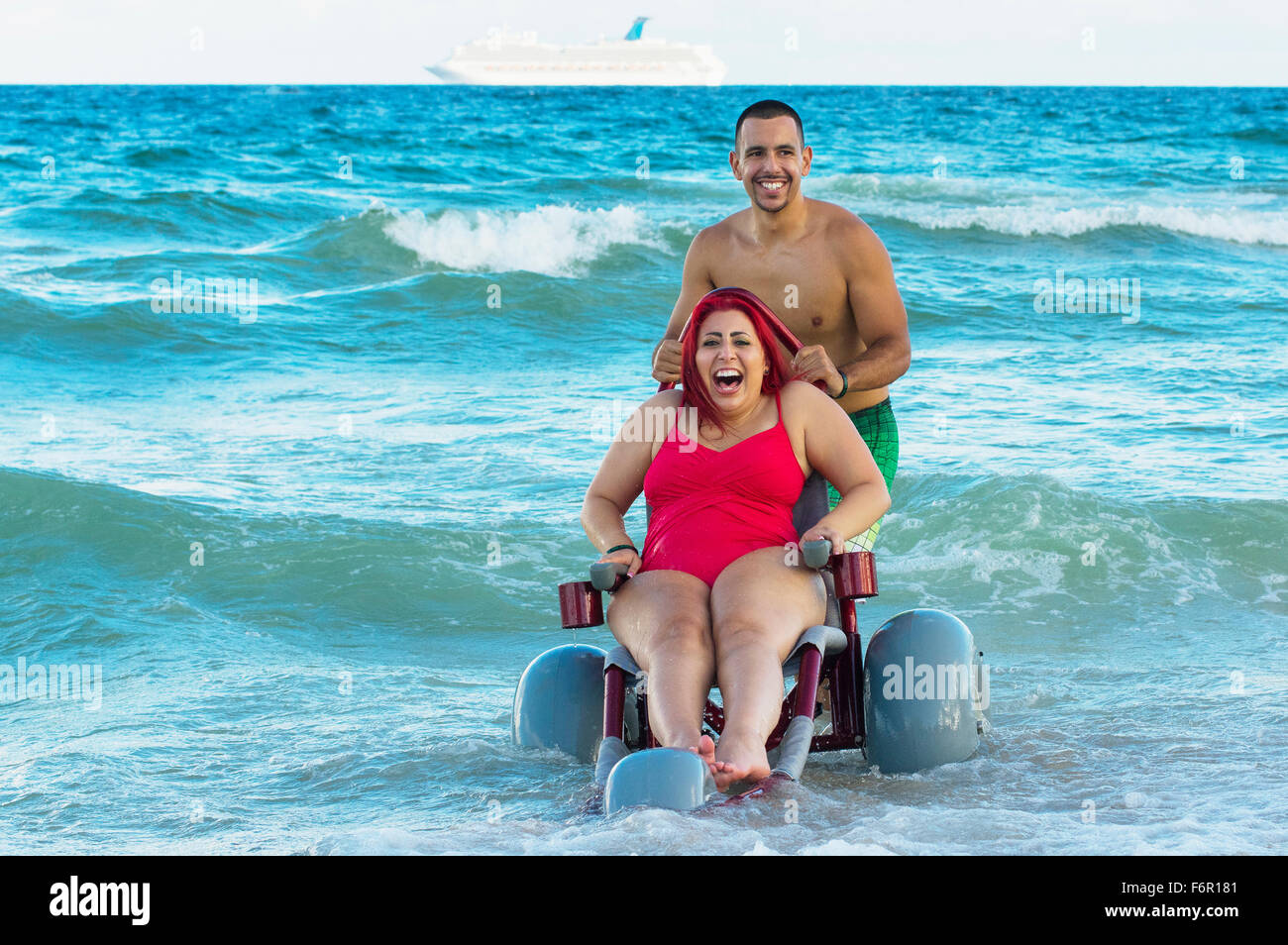 Man pushing paraplegic girlfriend in wheelchair on beach Stock Photo ... Man pushing paraplegic girlfriend in wheelchair on beach Stock Photo ...