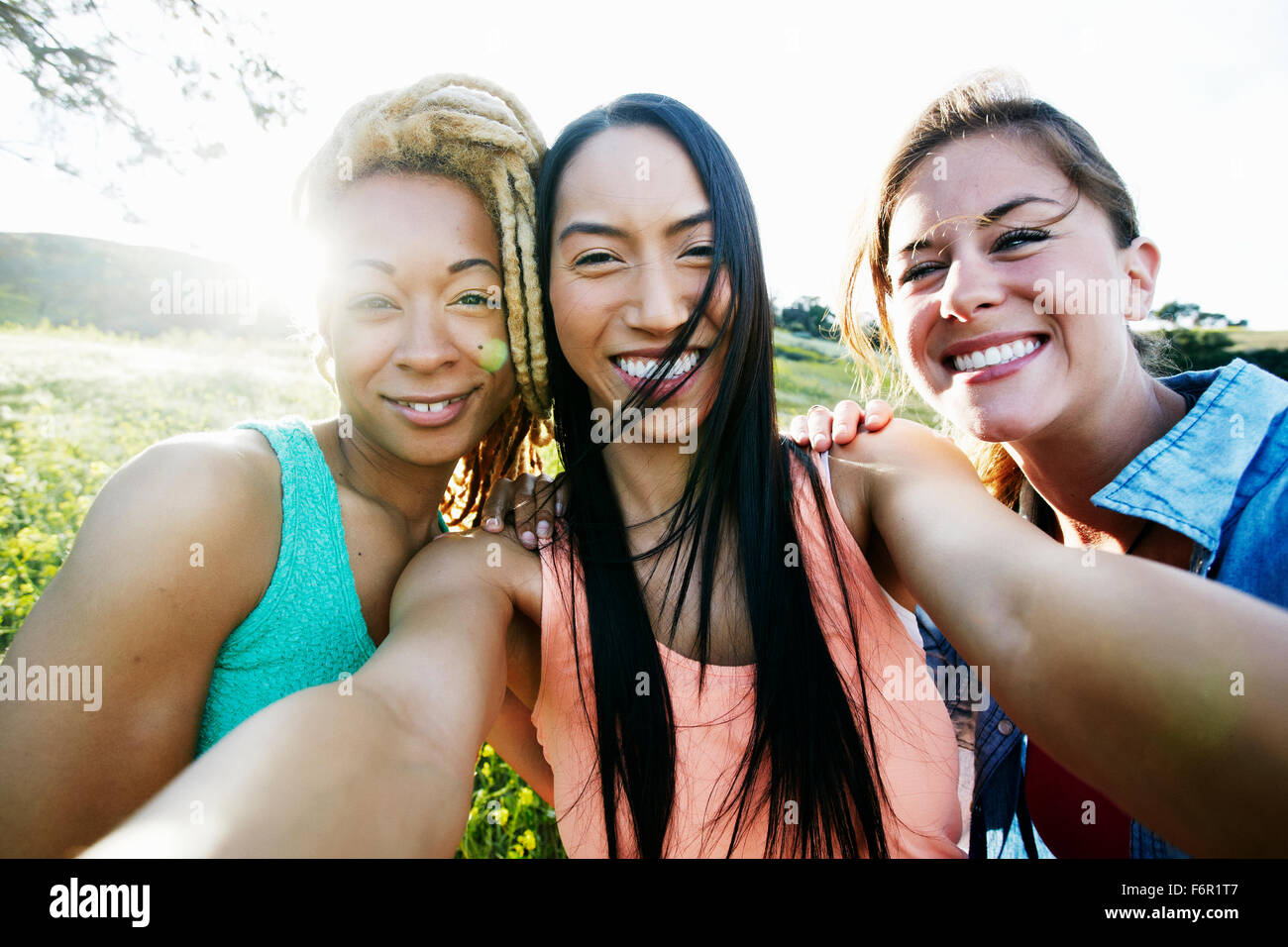 Friends taking selfie outdoors Stock Photo - Alamy