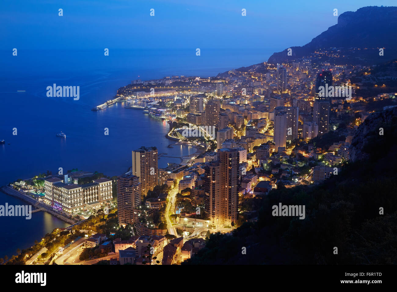 Monte Carlo, illuminated city view in the evening, Monaco, Cote d'Azur ...