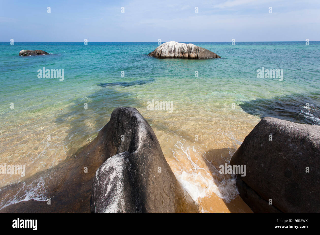 Large rocks in the crsytal clear waters of the south china sea off of ...