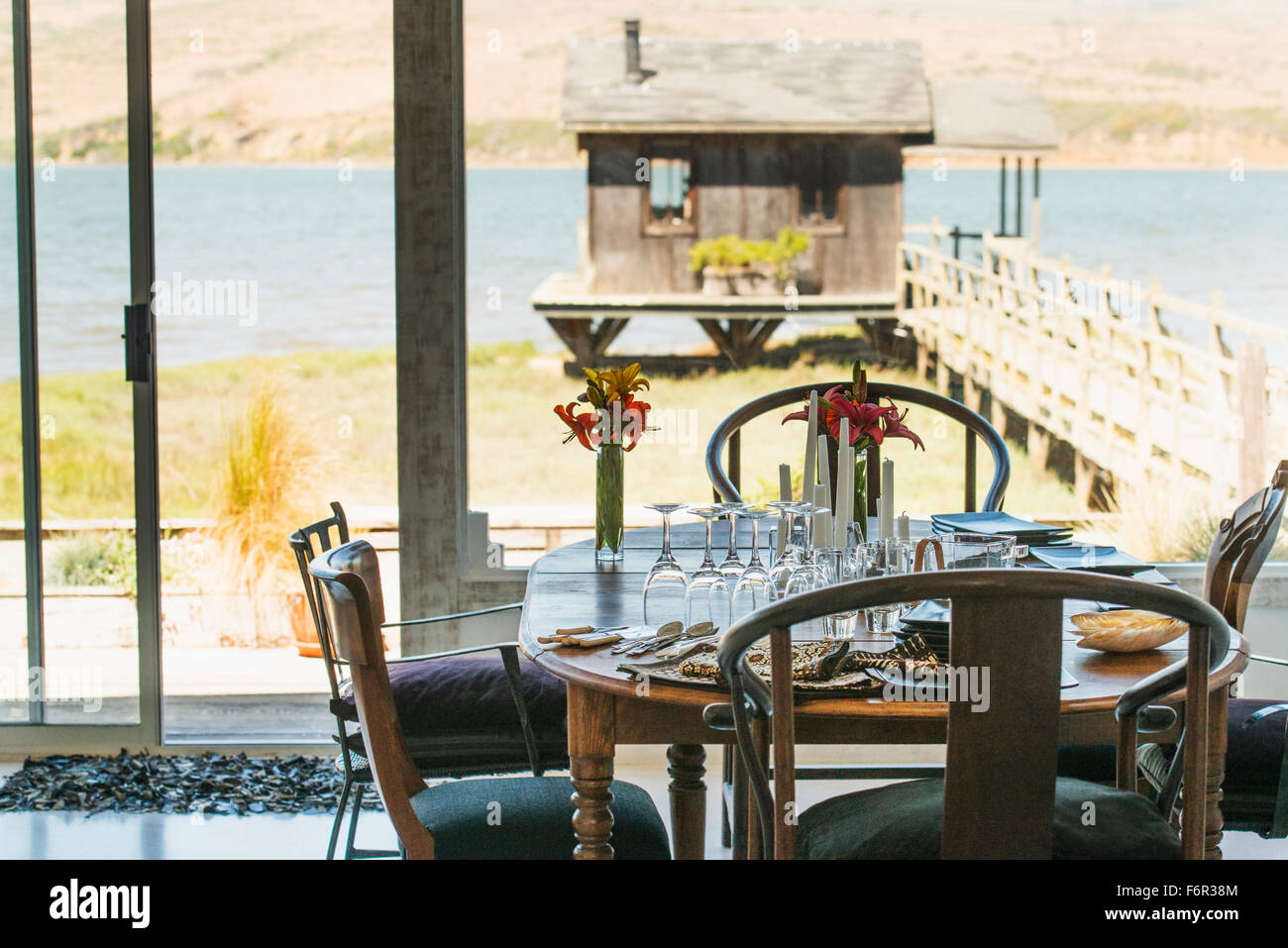 Dining room table and dock house Stock Photo - Alamy