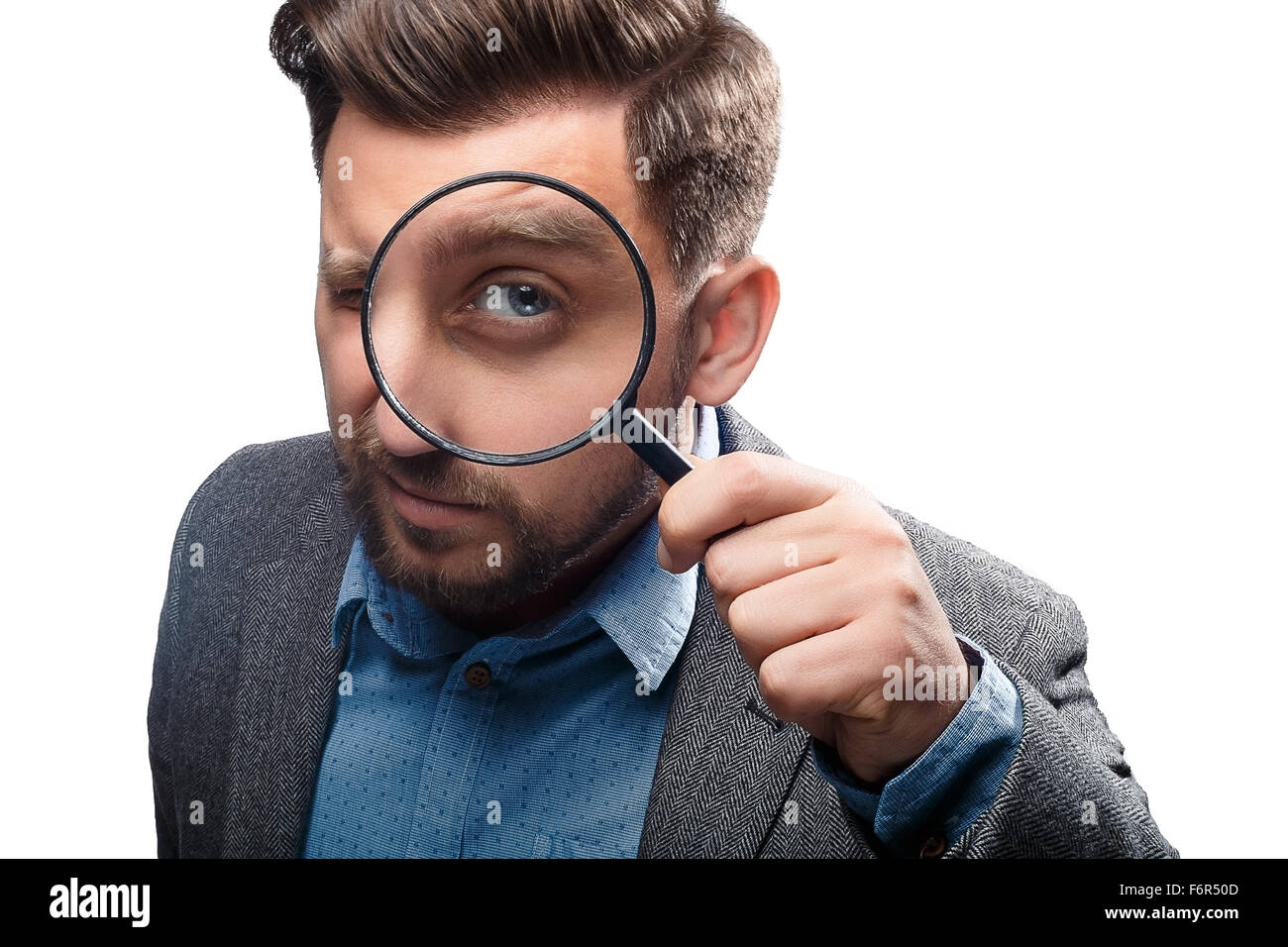 Man with magnifying glass on white background Stock Photo - Alamy