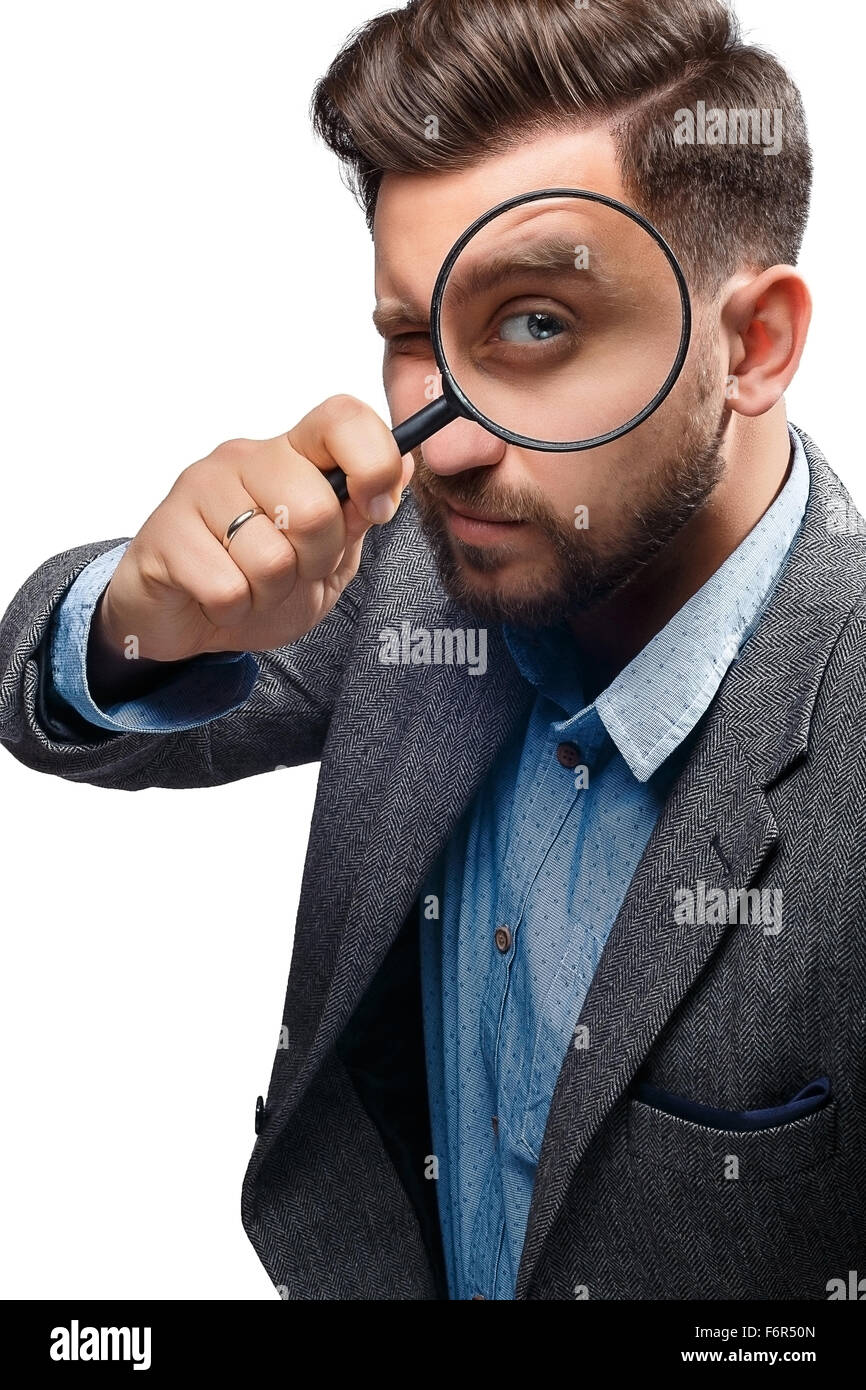 Man with magnifying glass on white background Stock Photo - Alamy