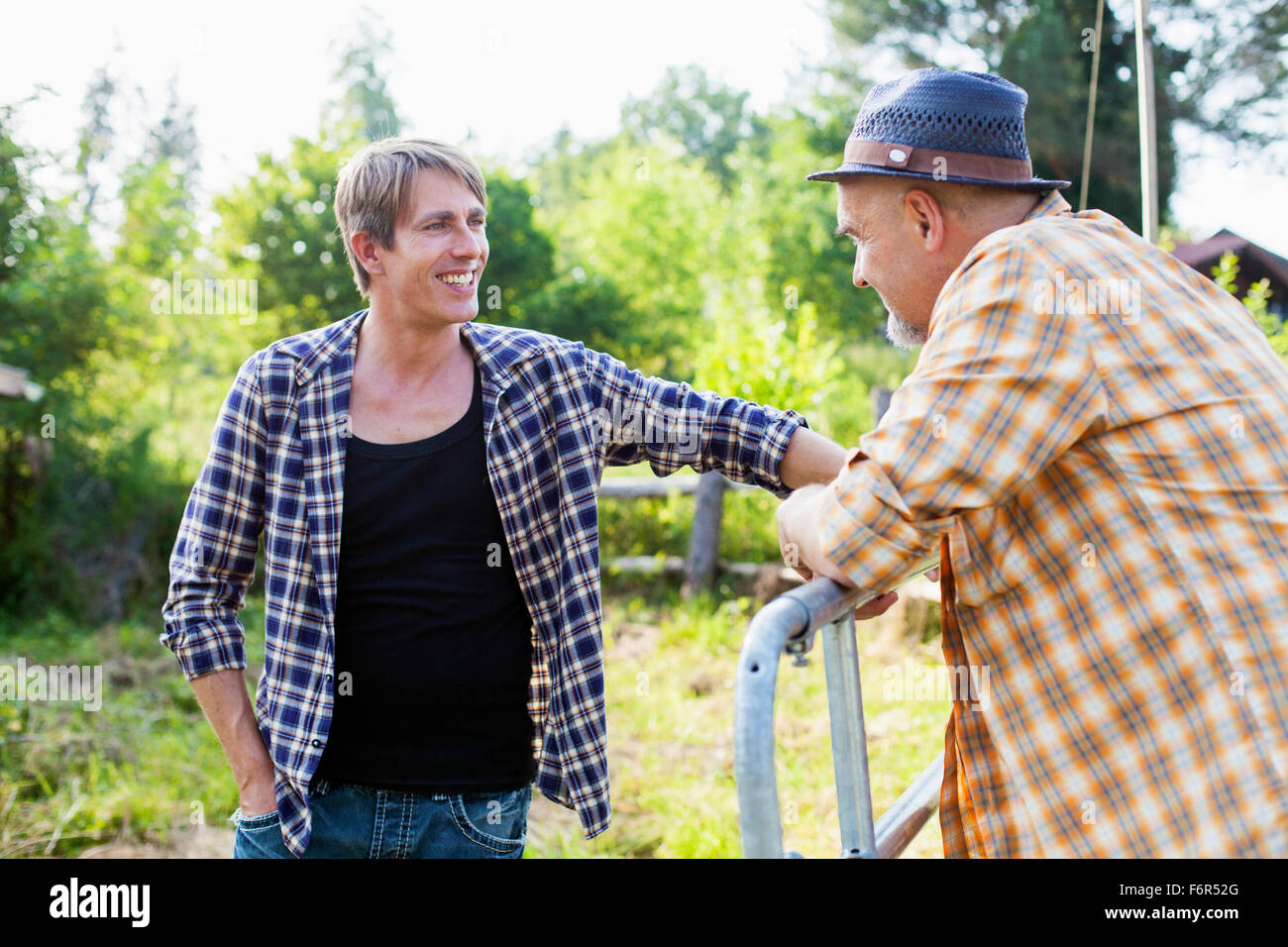 Two people fence talking hi-res stock photography and images - Alamy
